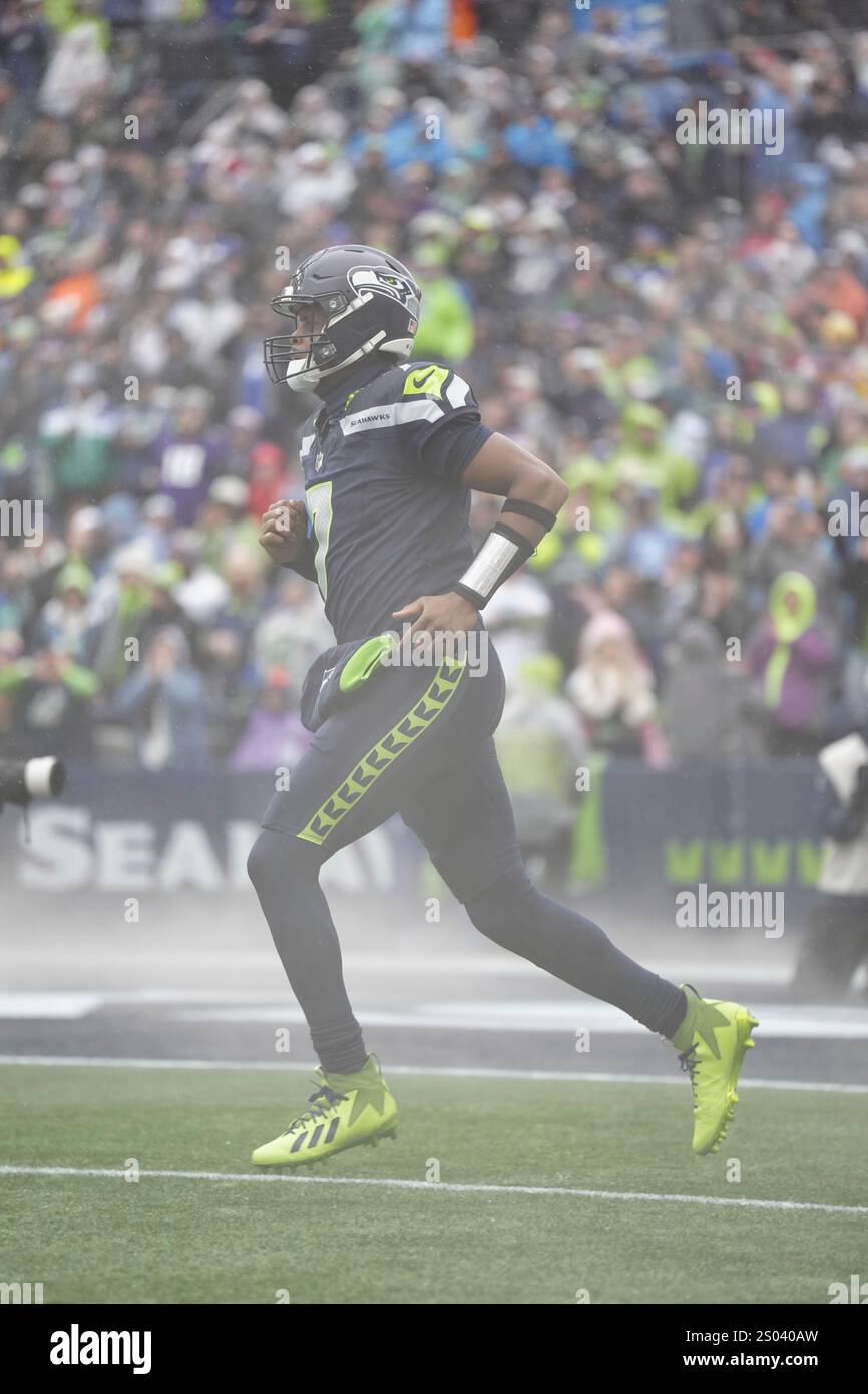 Seattle Seahawks quarterback Geno Smith (7) runs onto the field before ...