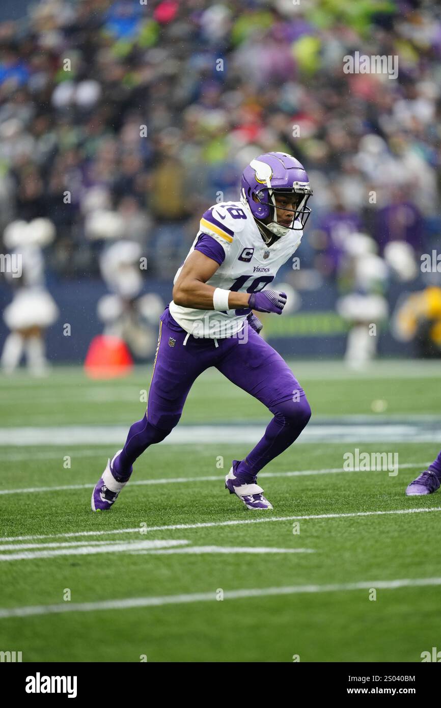 Minnesota Vikings wide receiver Justin Jefferson (18) gets set during an NFL football game ...