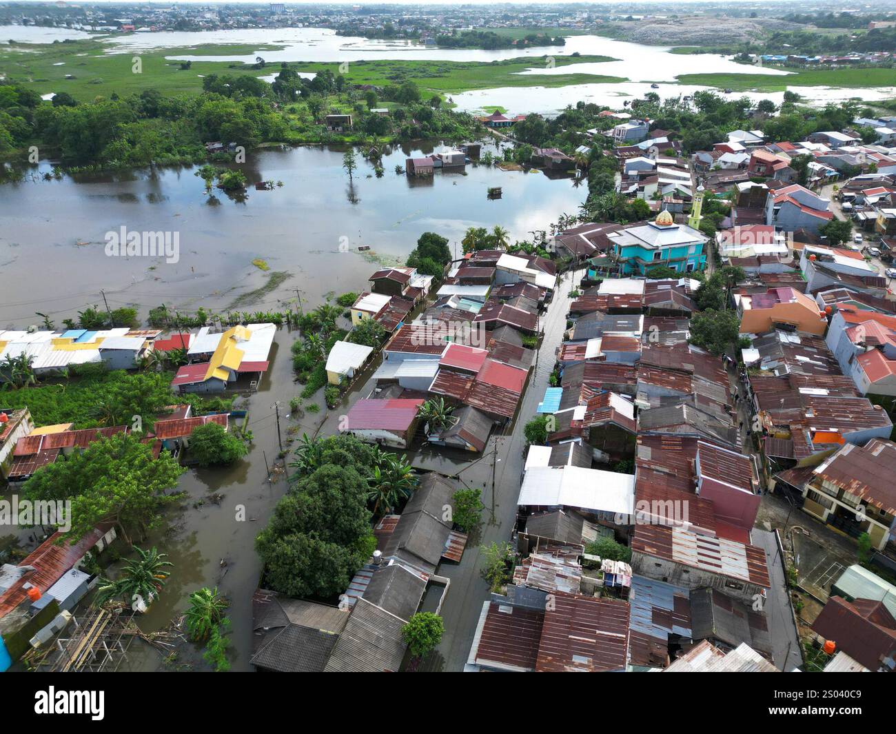 Makassar. 24th Dec, 2024. An aerial drone photo taken on Dec. 24, 2024 shows a flooded ...
