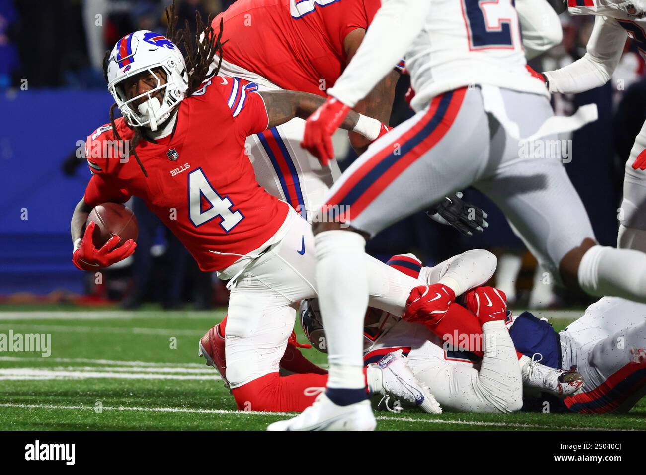 Buffalo Bills running back James Cook (4) is tackled during the second ...
