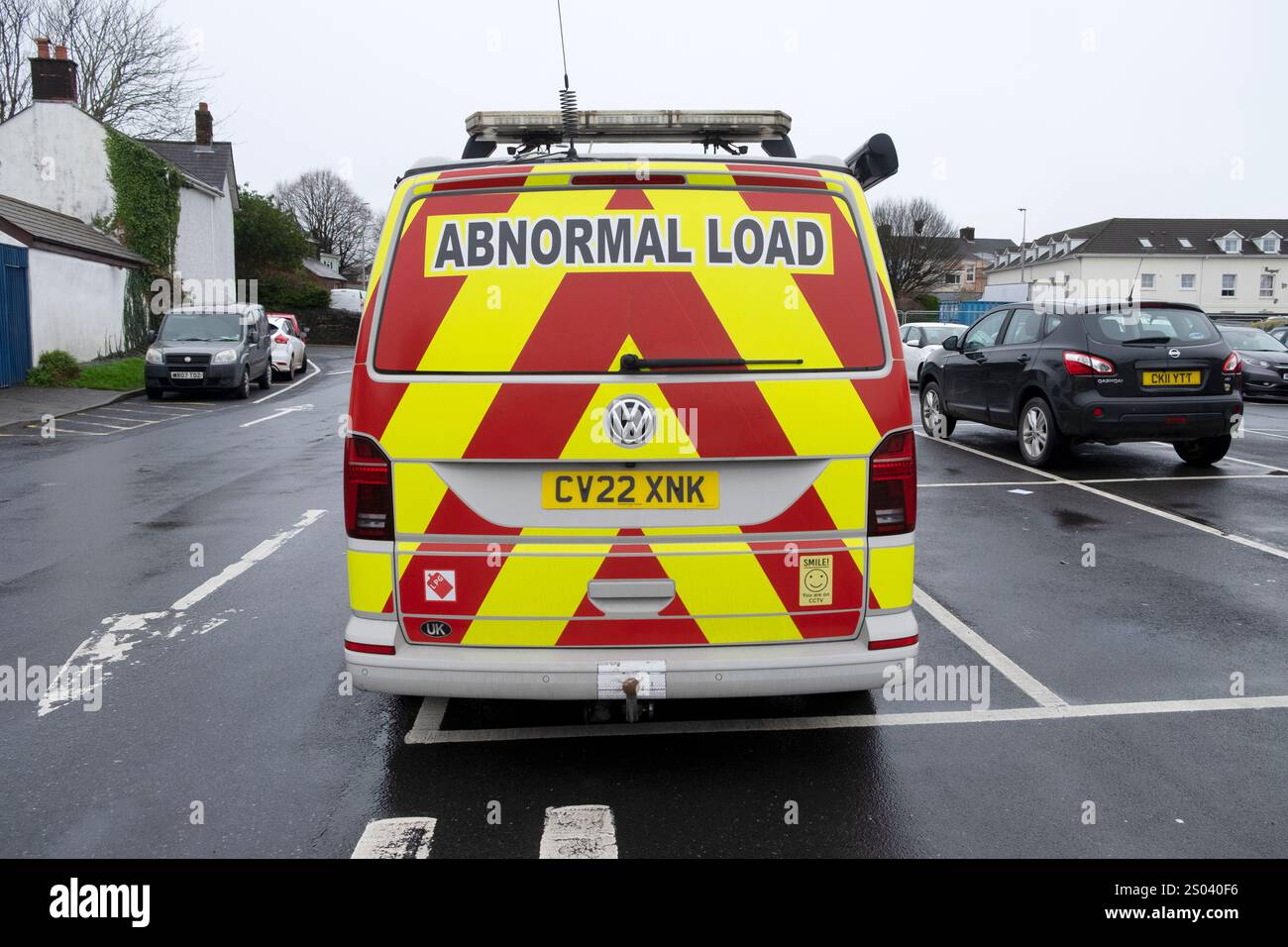 'Abnormal Load' sign on back rear of white van with yellow and red ...