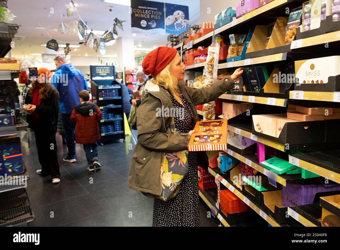 Woman shopper in M&S Marks and Spencer supermarket store food hall last ...
