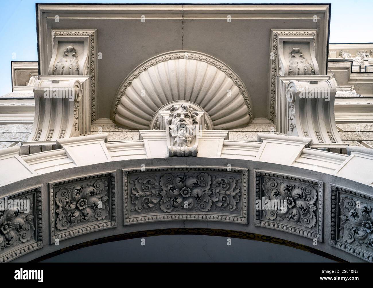 A close-up view of an ornate architectural arch featuring intricate ...