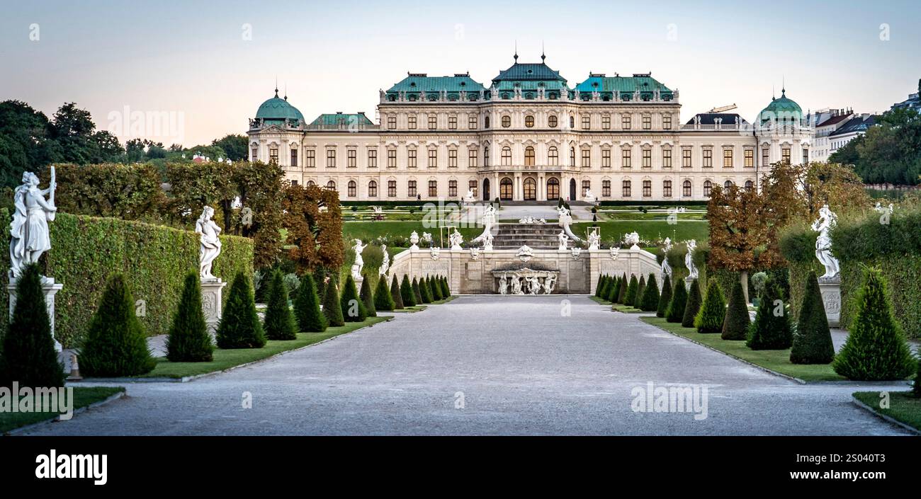 A grand palace surrounded by meticulously landscaped gardens, featuring ...