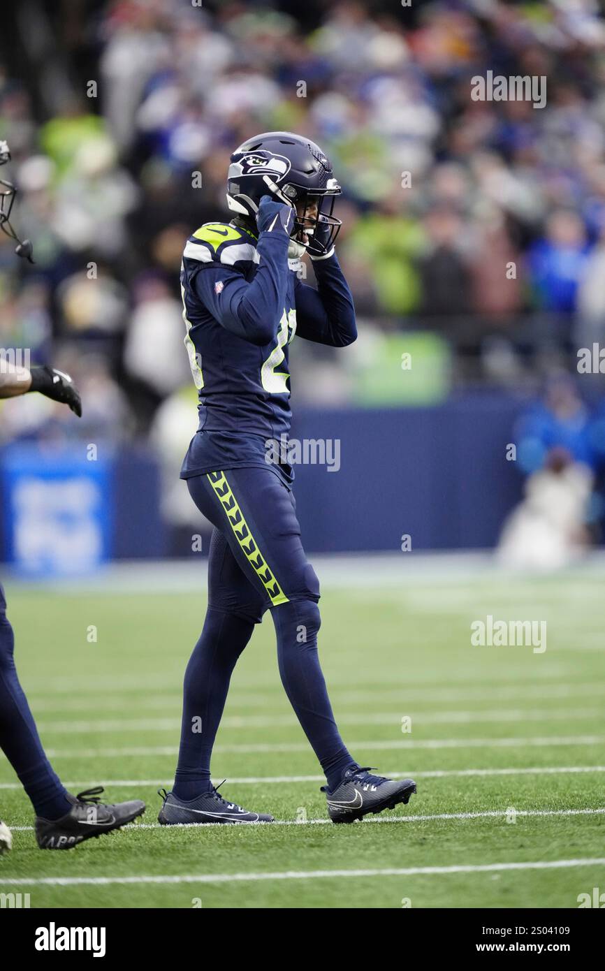 Seattle Seahawks cornerback Devon Witherspoon (21) looks on during an ...