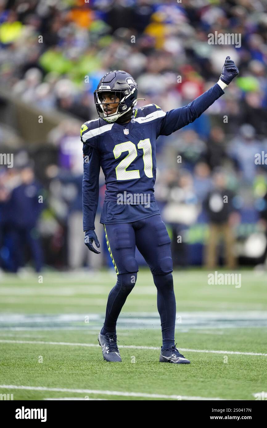 Seattle Seahawks cornerback Devon Witherspoon (21) looks on during an ...