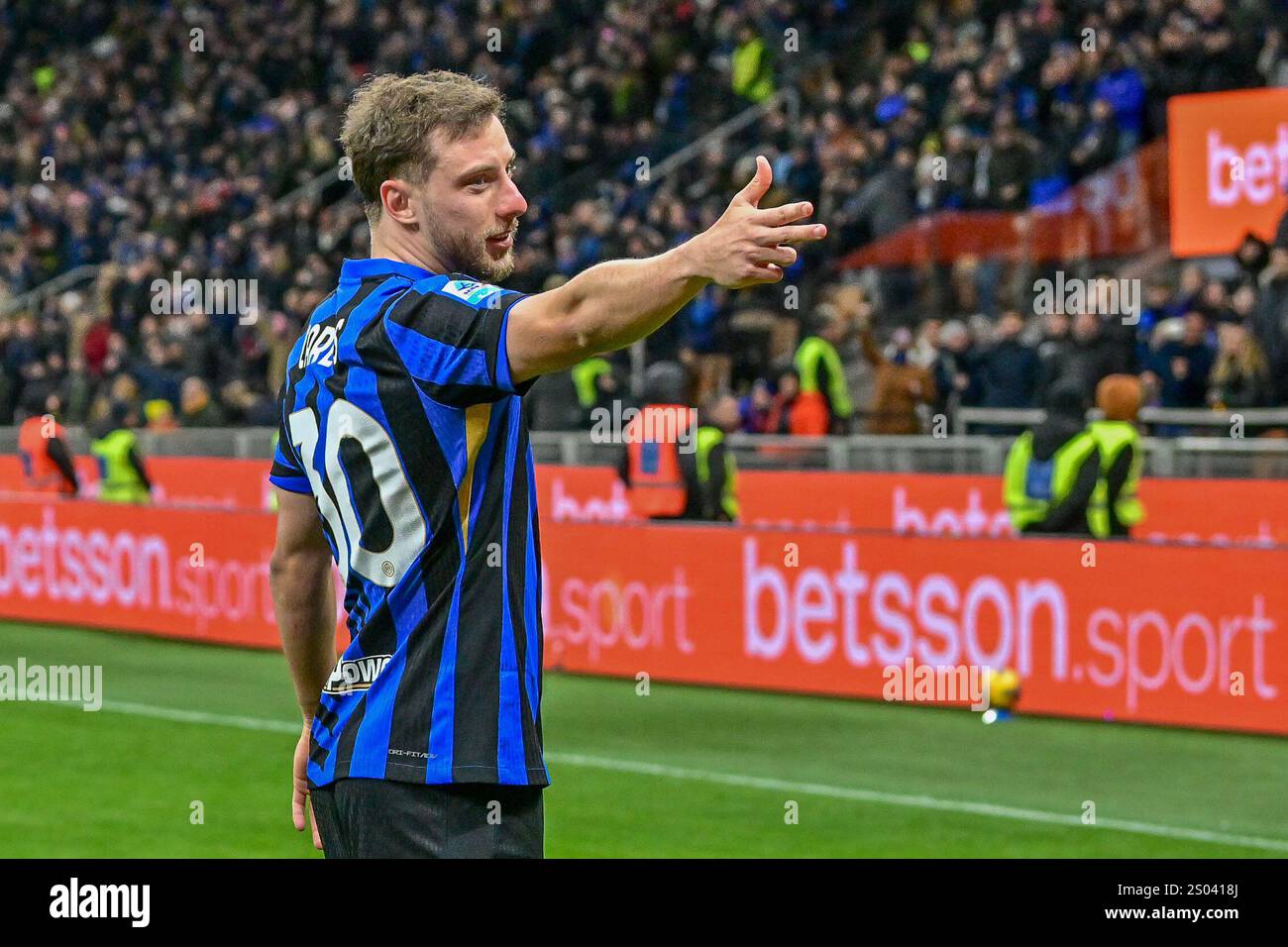Milano, Italy. 23rd Dec, 2024. Carlos Augusto (30) of Inter scores for ...