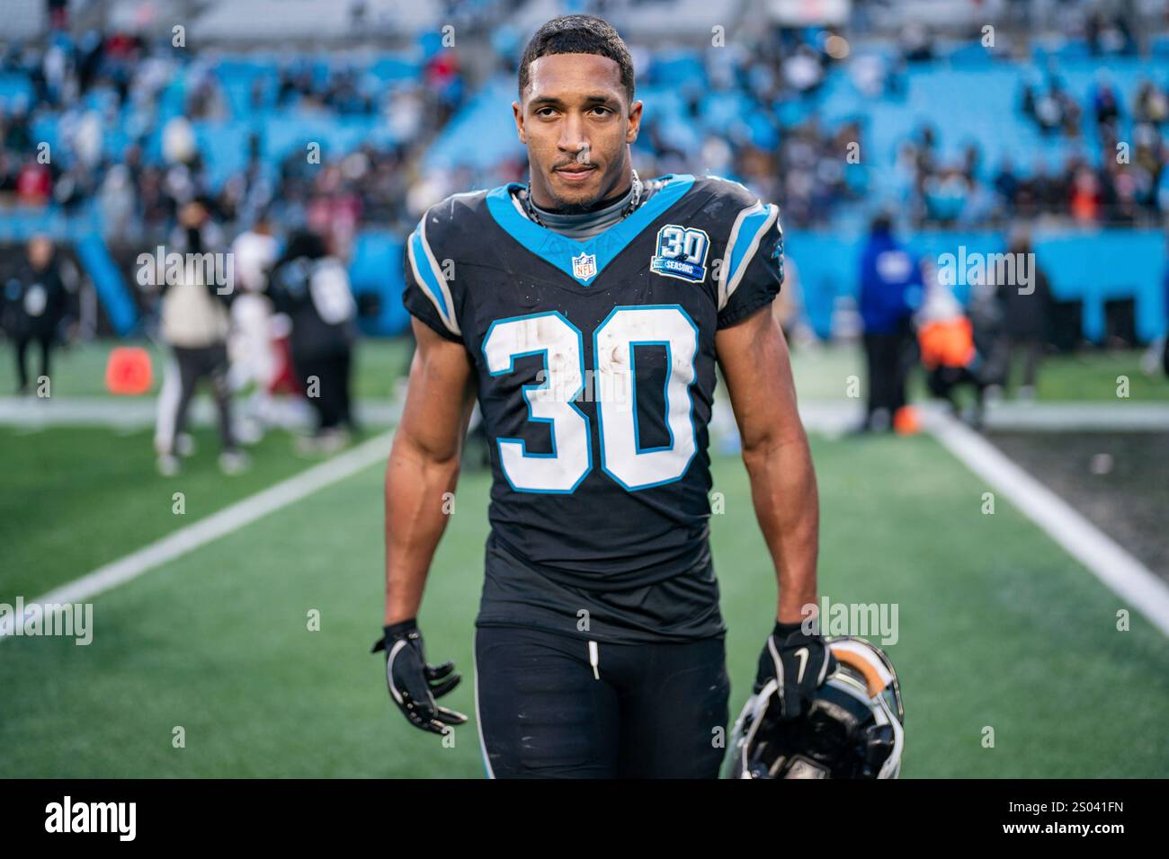 Carolina Panthers running back Chuba Hubbard (30) walks off the field ...