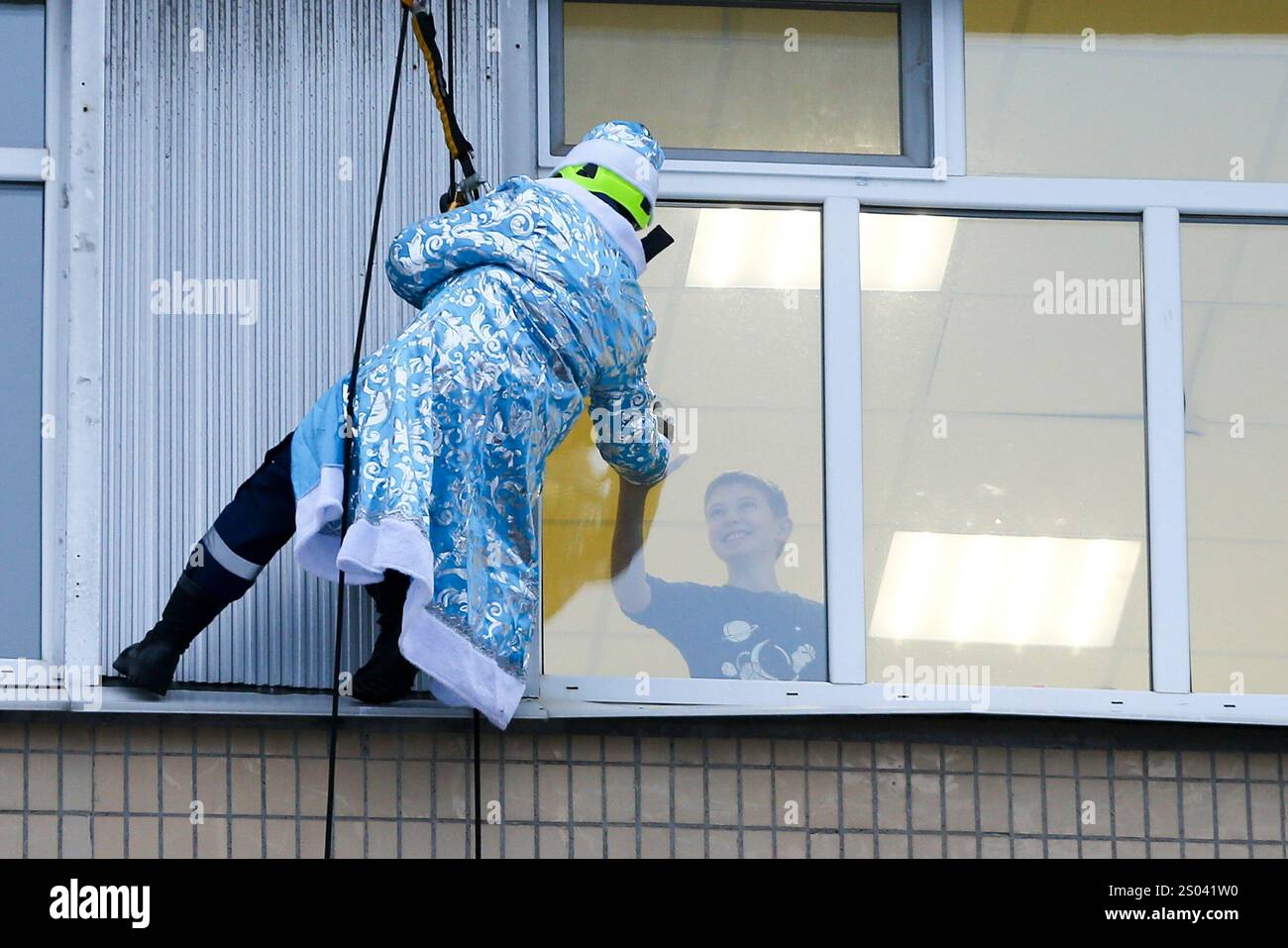A Russian emergency rescue worker dressed as Ded Moroz (Santa Claus, or ...