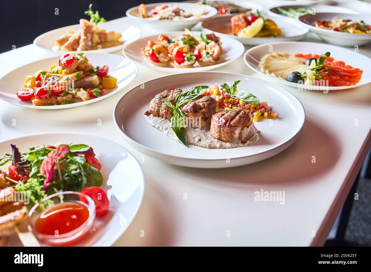 A beautifully set table with a selection of gourmet appetizers, main ...