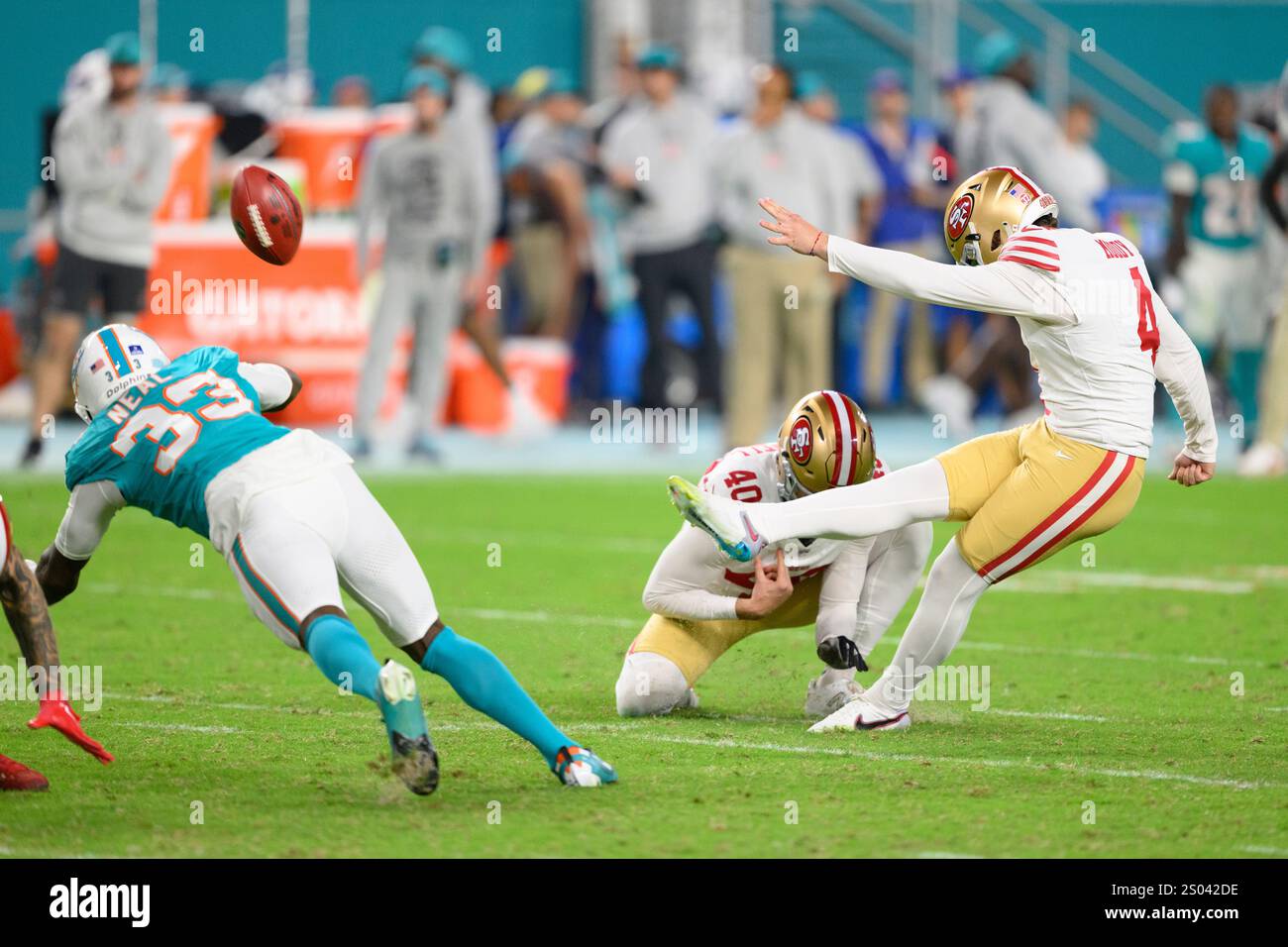 San Francisco 49ers punter Pat O'Donnell (40) holds the ball as kicker ...