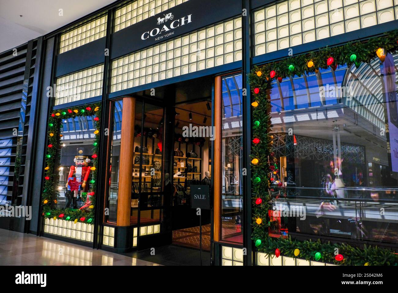 View of a decorated Coach shop during Christmas eve retail at Chadstone ...