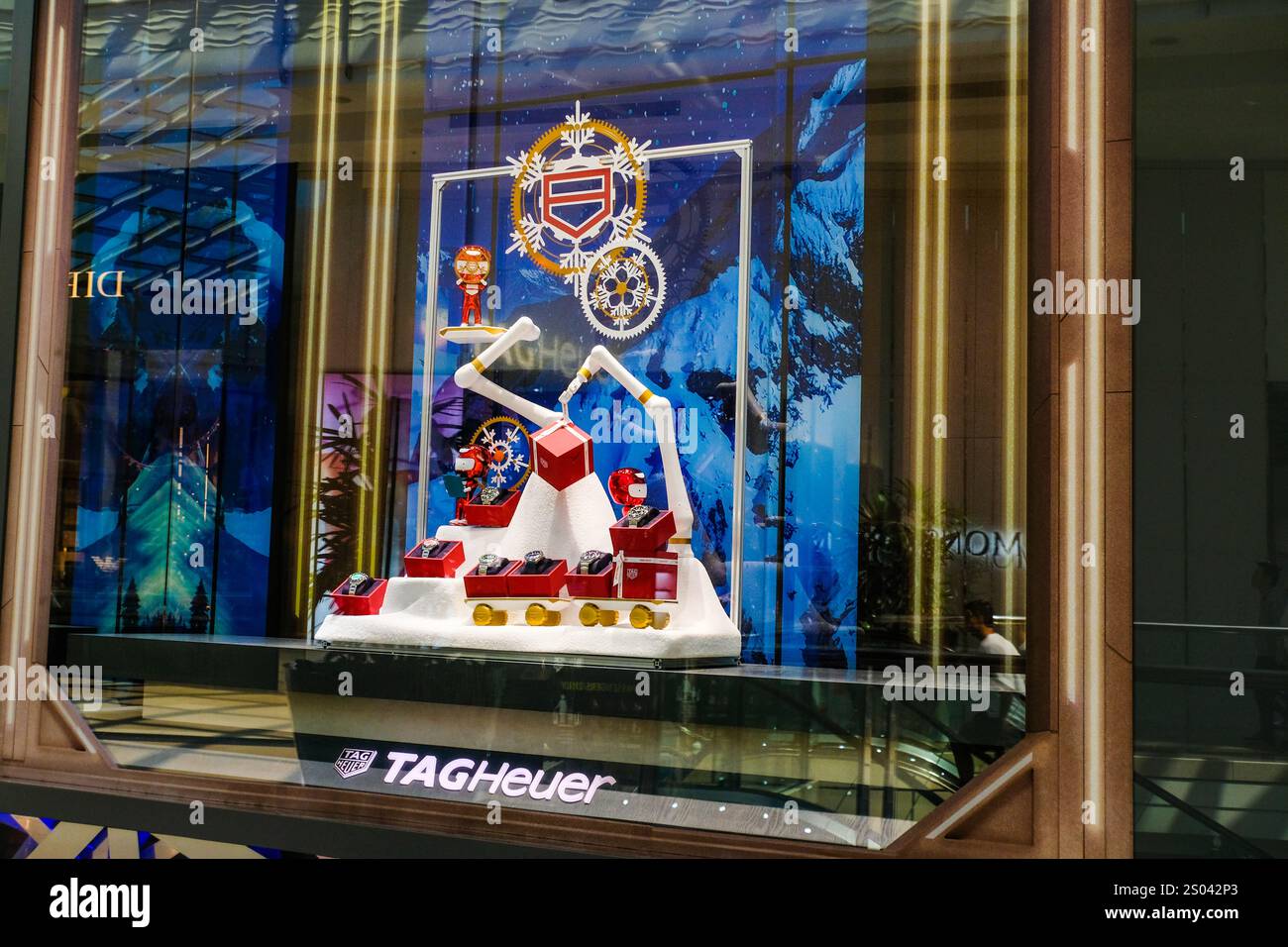Christmas themed window display of TAG Heuer store during Christmas eve ...