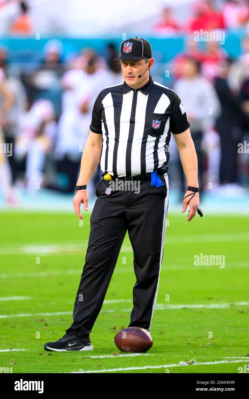 NFL umpire Mark Ellis walks onto the field before an NFL football game ...