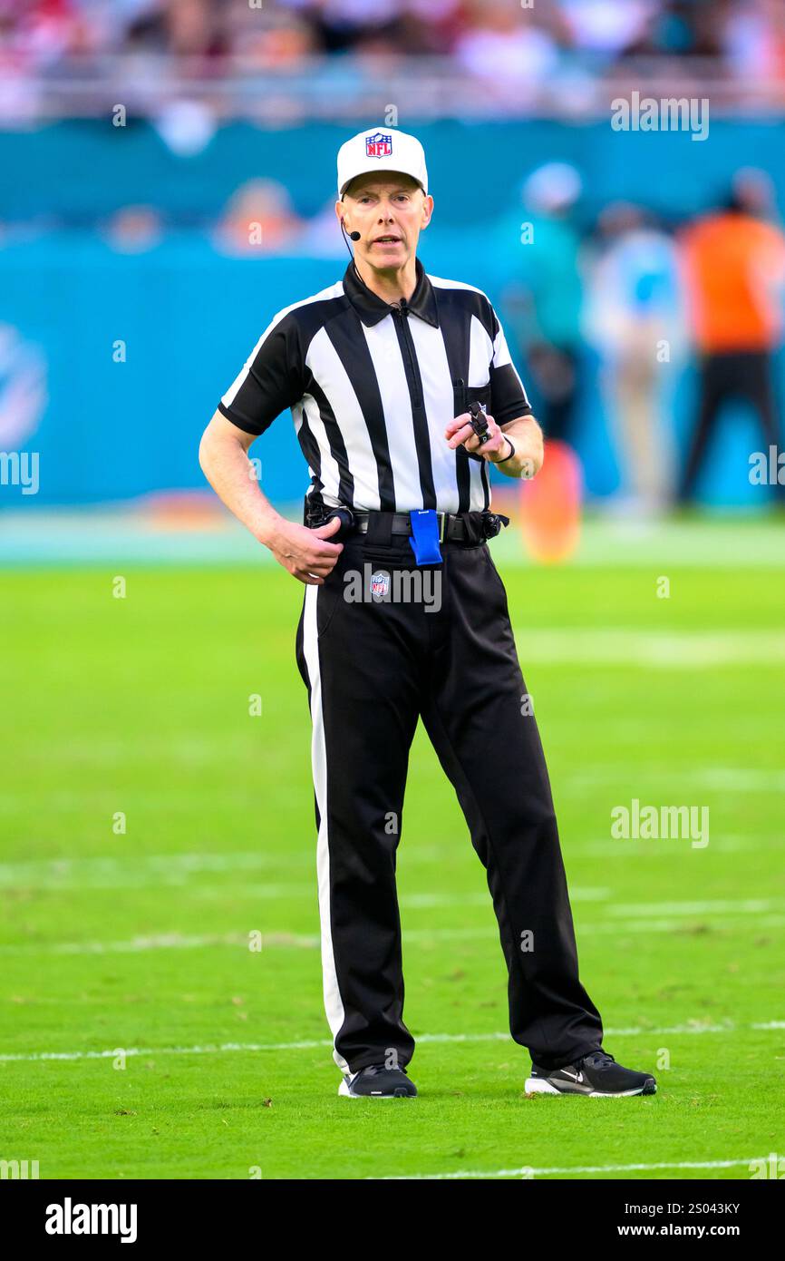 NFL referee Scott Novak stands on the field before an NFL football game ...