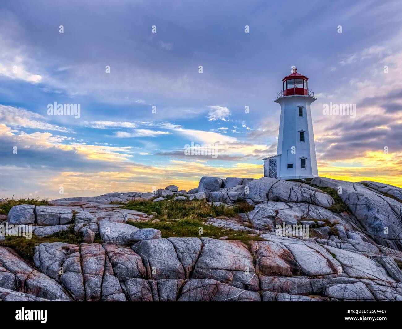 Sunset at Peggys Point Lighthouse also known as Peggys Cove Lighthouse ...