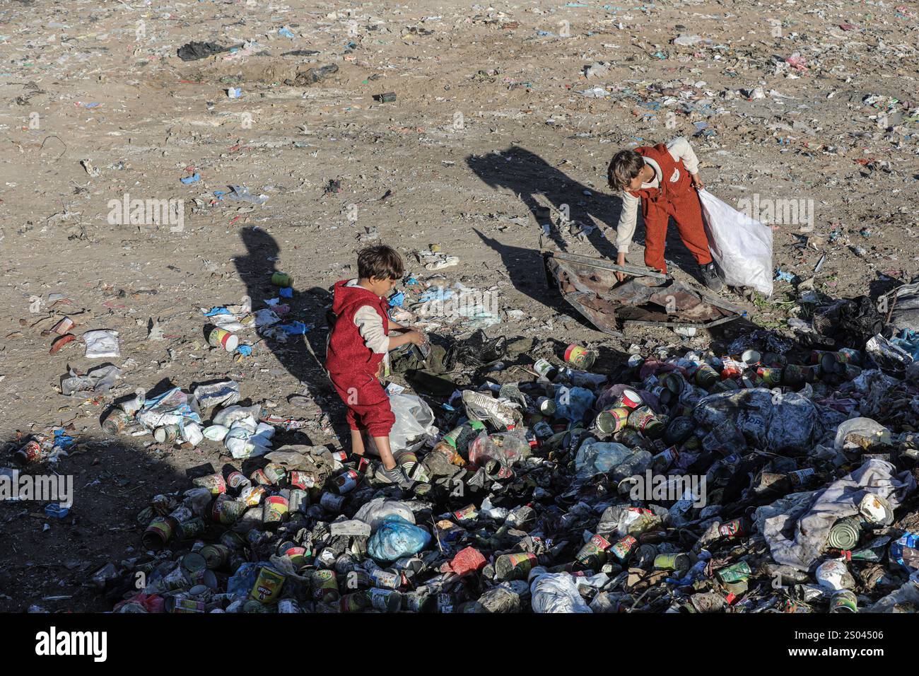 A view of the area where people live in makeshift tents near trash ...