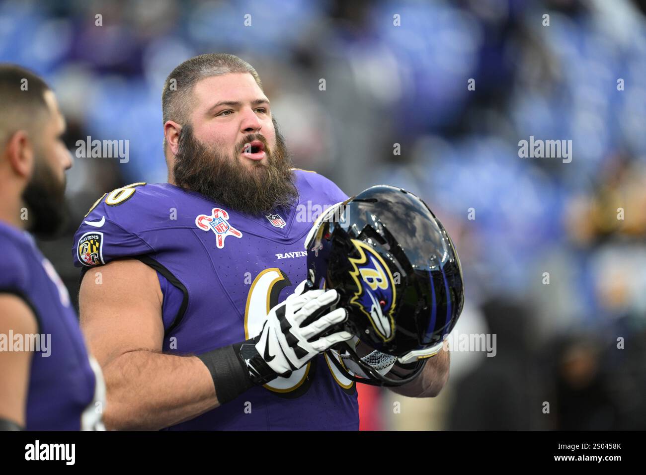 Baltimore Ravens guard Ben Cleveland looks on during pre-game warm-ups ...