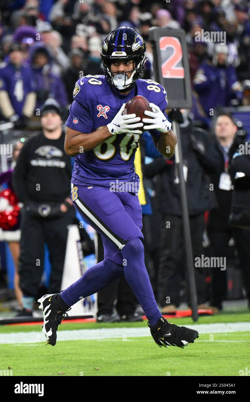Baltimore Ravens tight end Isaiah Likely (80) catches the ball for a ...