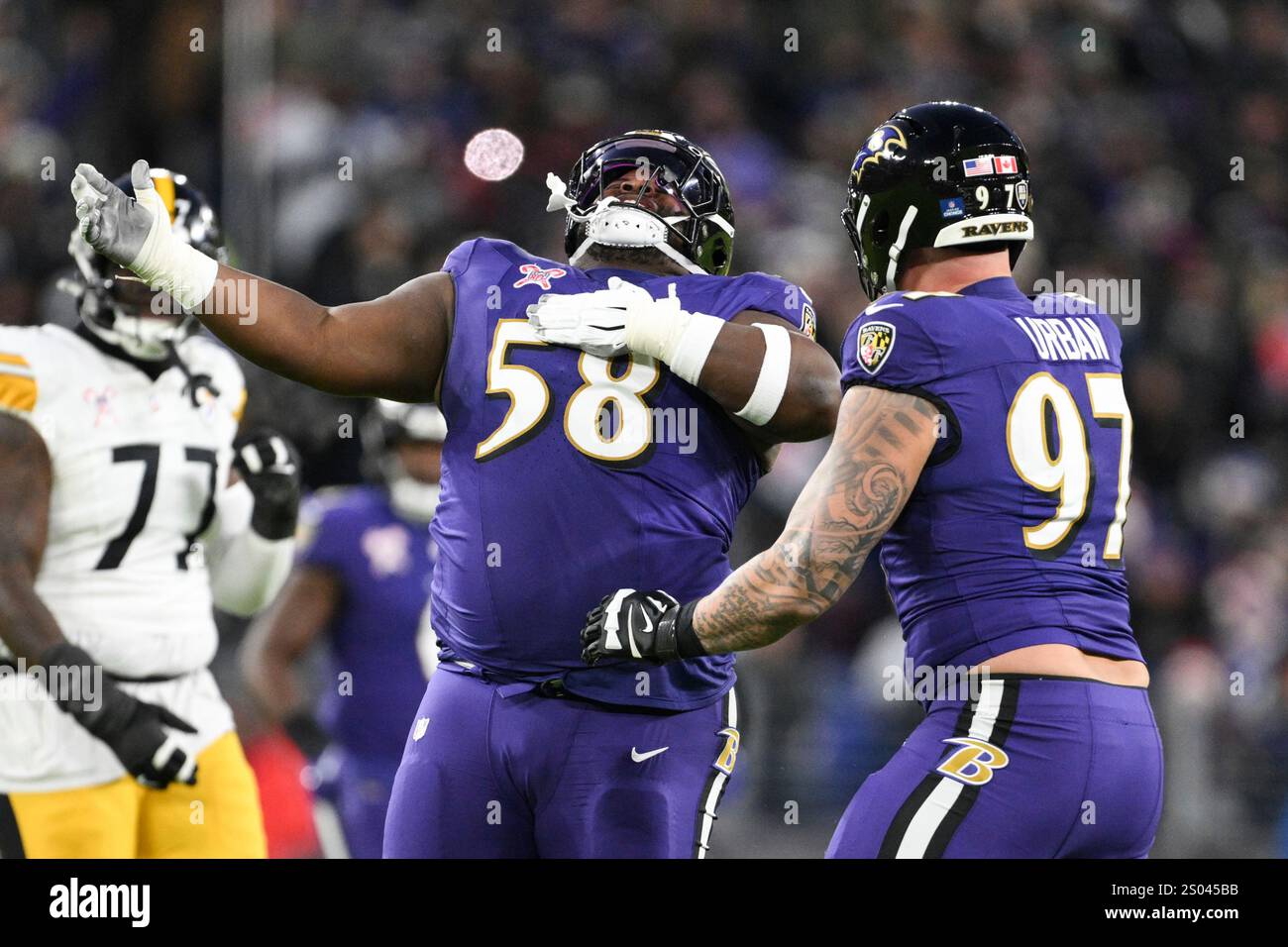 Baltimore Ravens defensive tackle Michael Pierce (58) celebrates his ...