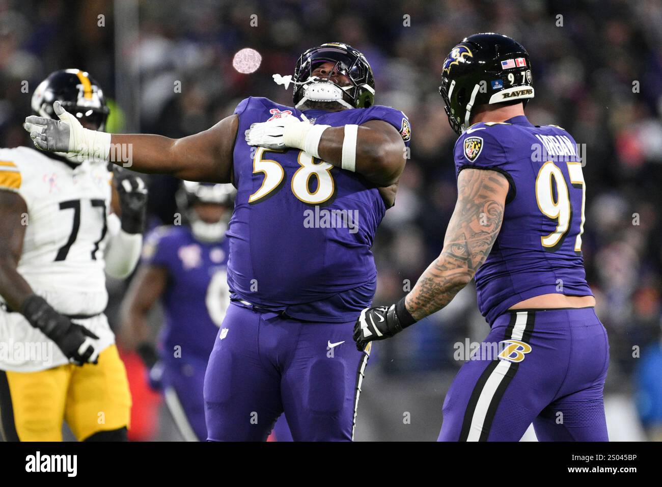 Baltimore Ravens defensive tackle Michael Pierce (58) celebrates his ...