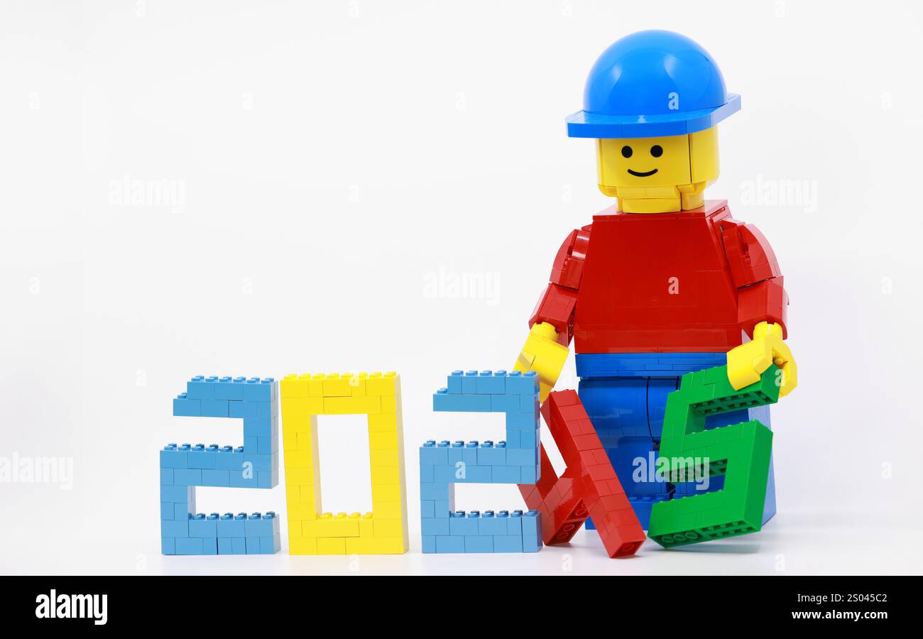 workers set up the new year 2025 wording Stock Photo - Alamy