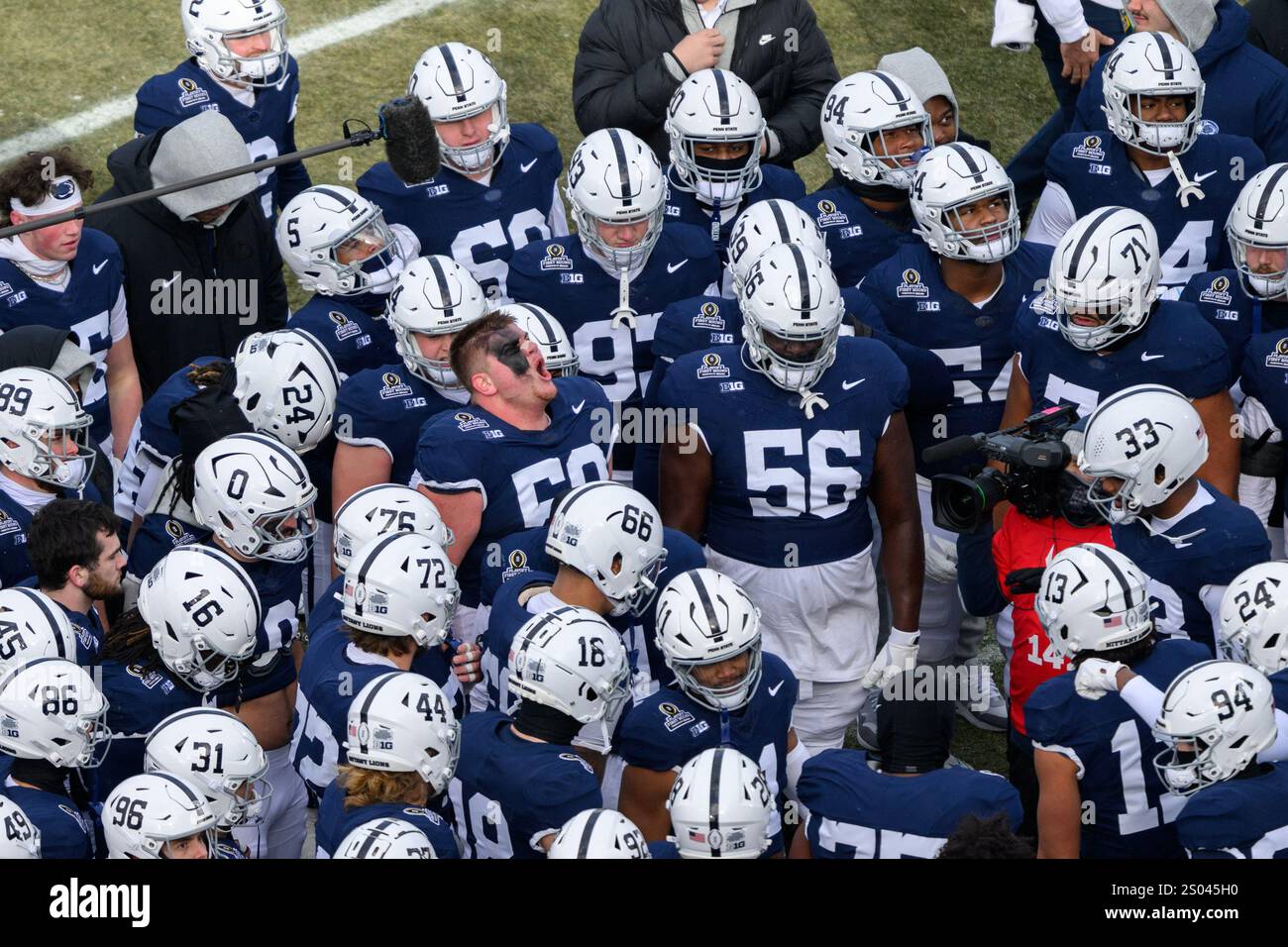 State College, PA, USA. 21st Dec, 2024. The Penn State Nittany Lions warm up before the NCAA ...