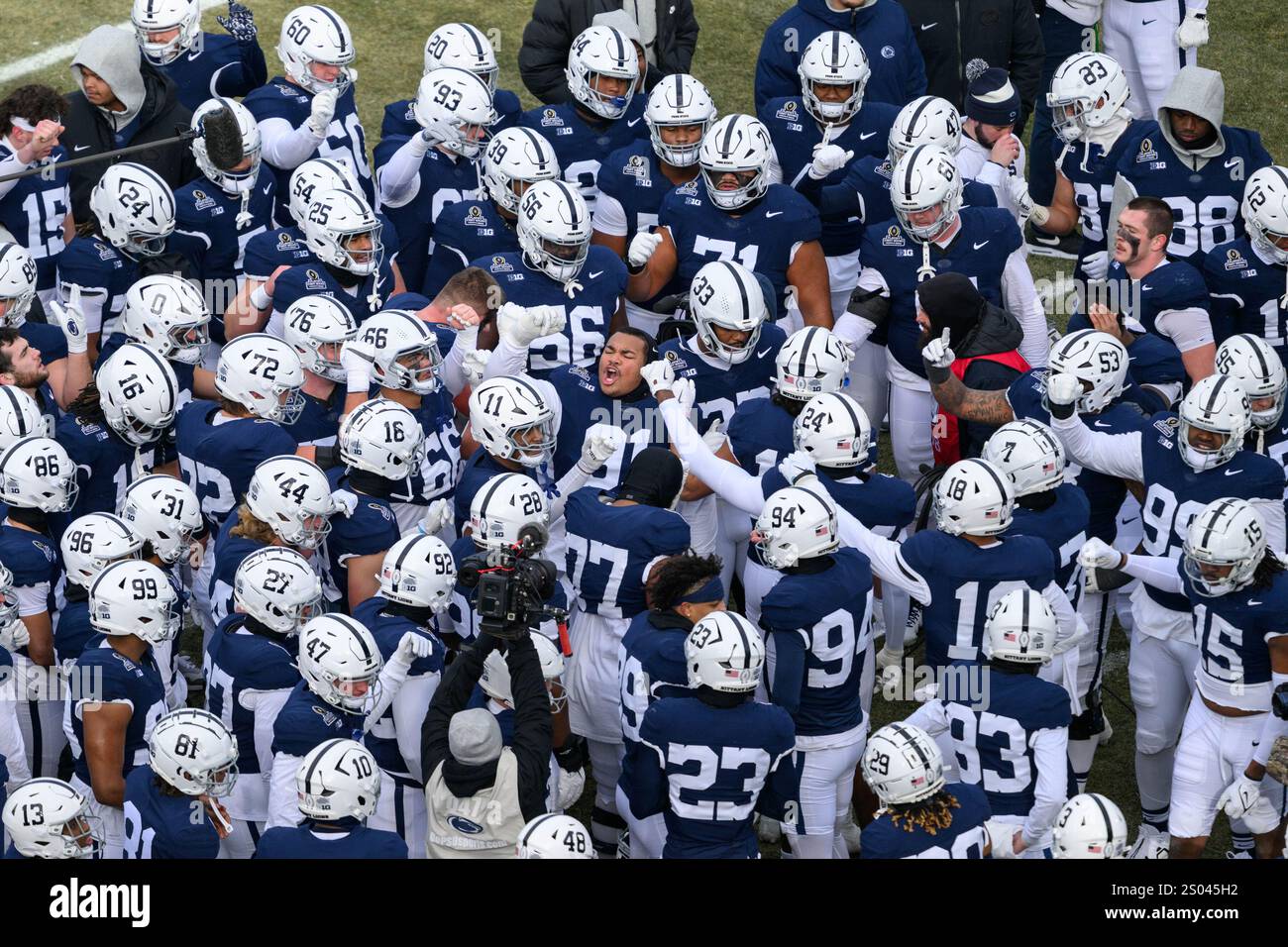 State College, PA, USA. 21st Dec, 2024. The Penn State Nittany Lions warm up before the NCAA ...