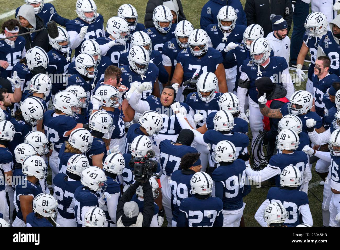 State College, PA, USA. 21st Dec, 2024. The Penn State Nittany Lions warm up before the NCAA ...
