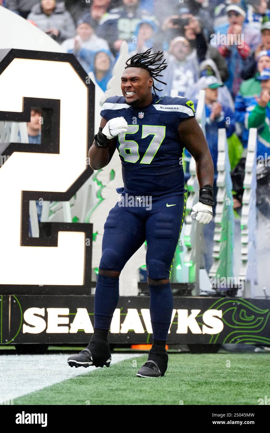 Seattle Seahawks offensive tackle Charles Cross (67) runs onto the ...