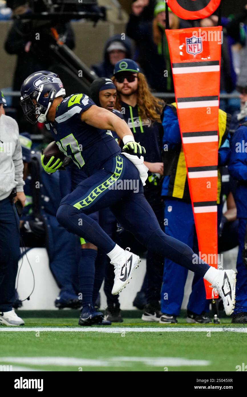 Seattle Seahawks tight end Noah Fant (87) runs with the ball during an ...