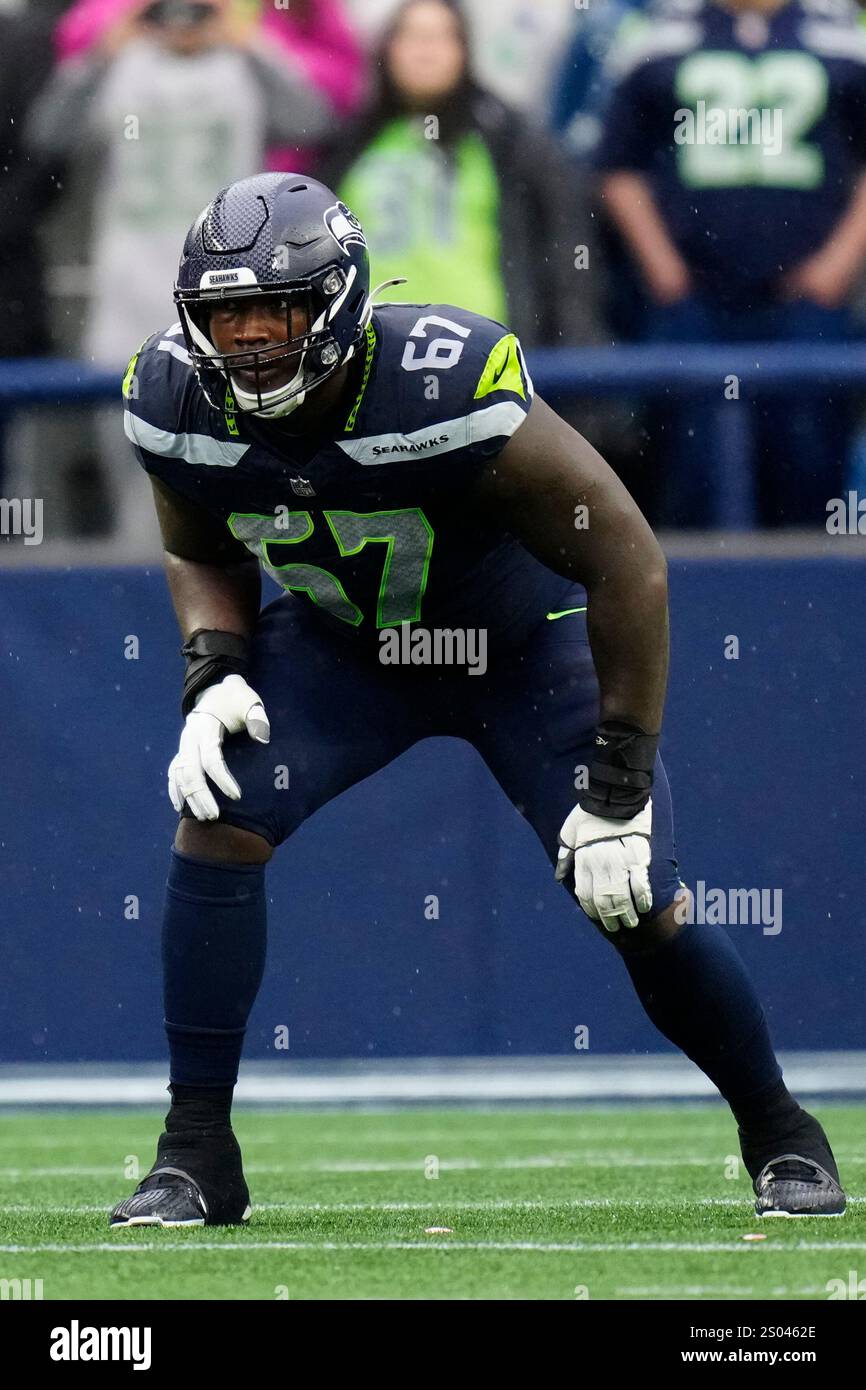 Seattle Seahawks offensive tackle Charles Cross (67) gets set during an ...