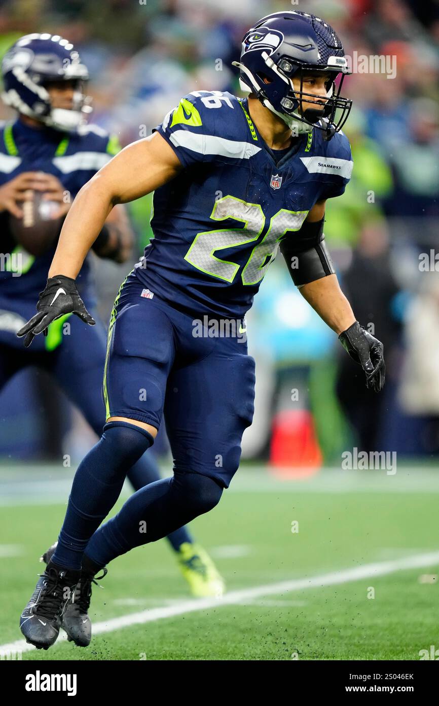 Seattle Seahawks running back Zach Charbonnet (26) gets set during an ...