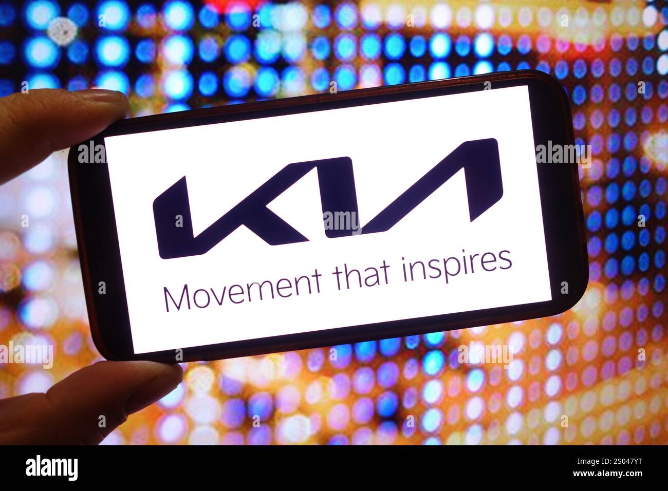 In this photo illustration, the Kia company logo is seen displayed on a ...