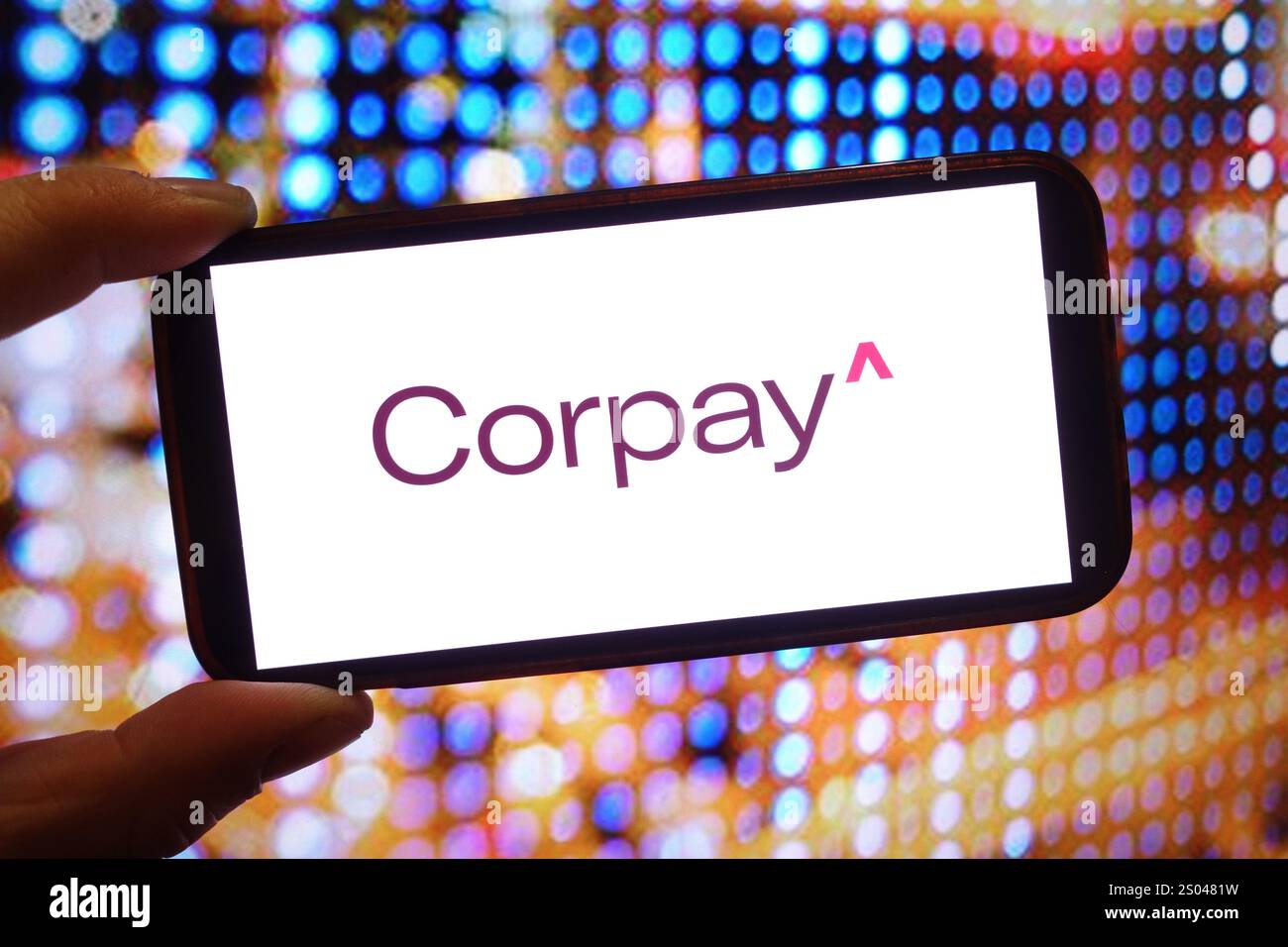 In this photo illustration, the Corpay company logo is seen displayed ...