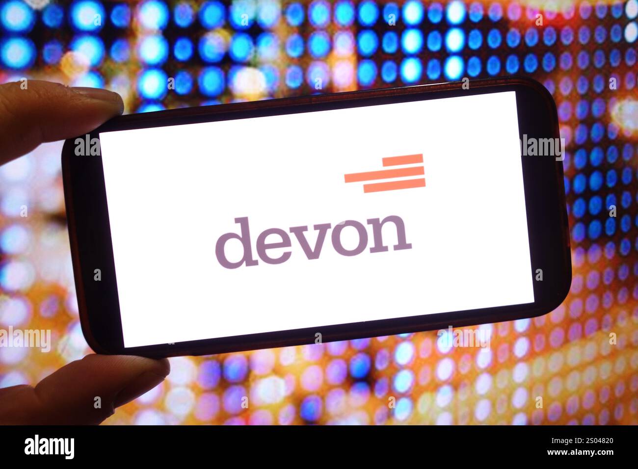 In this photo illustration, the Devon Energy company logo is seen ...