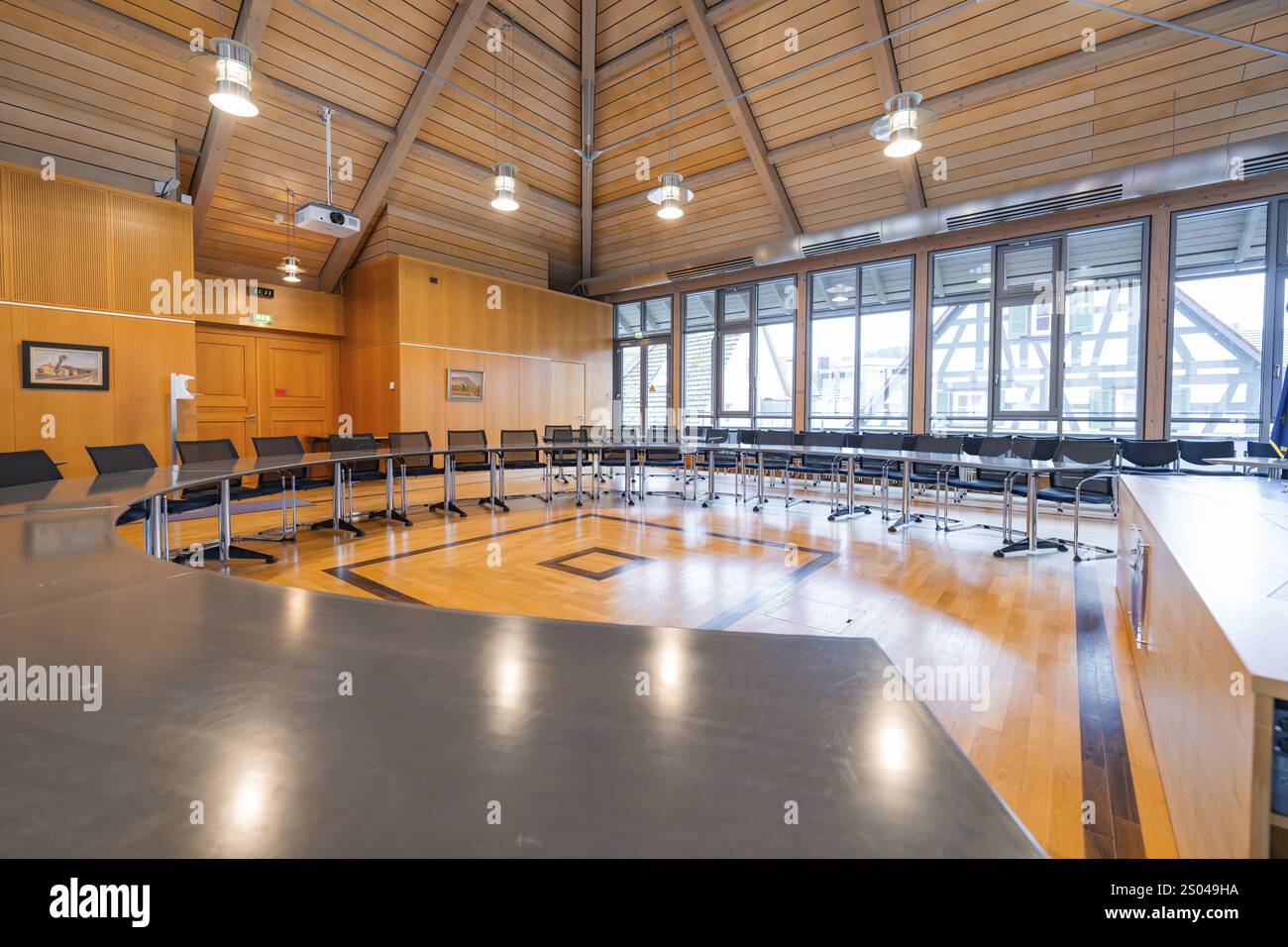 Conference room with modern wood design and many windows ...