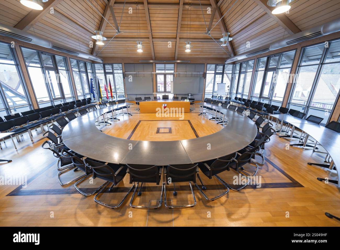 Large, modern conference room with wooden ceiling and large windows ...