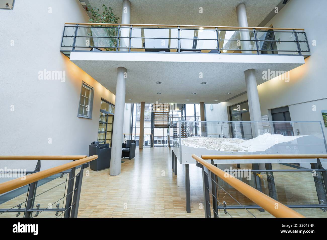 Modern atrium with glass railings and open room structure, Nagold Town ...