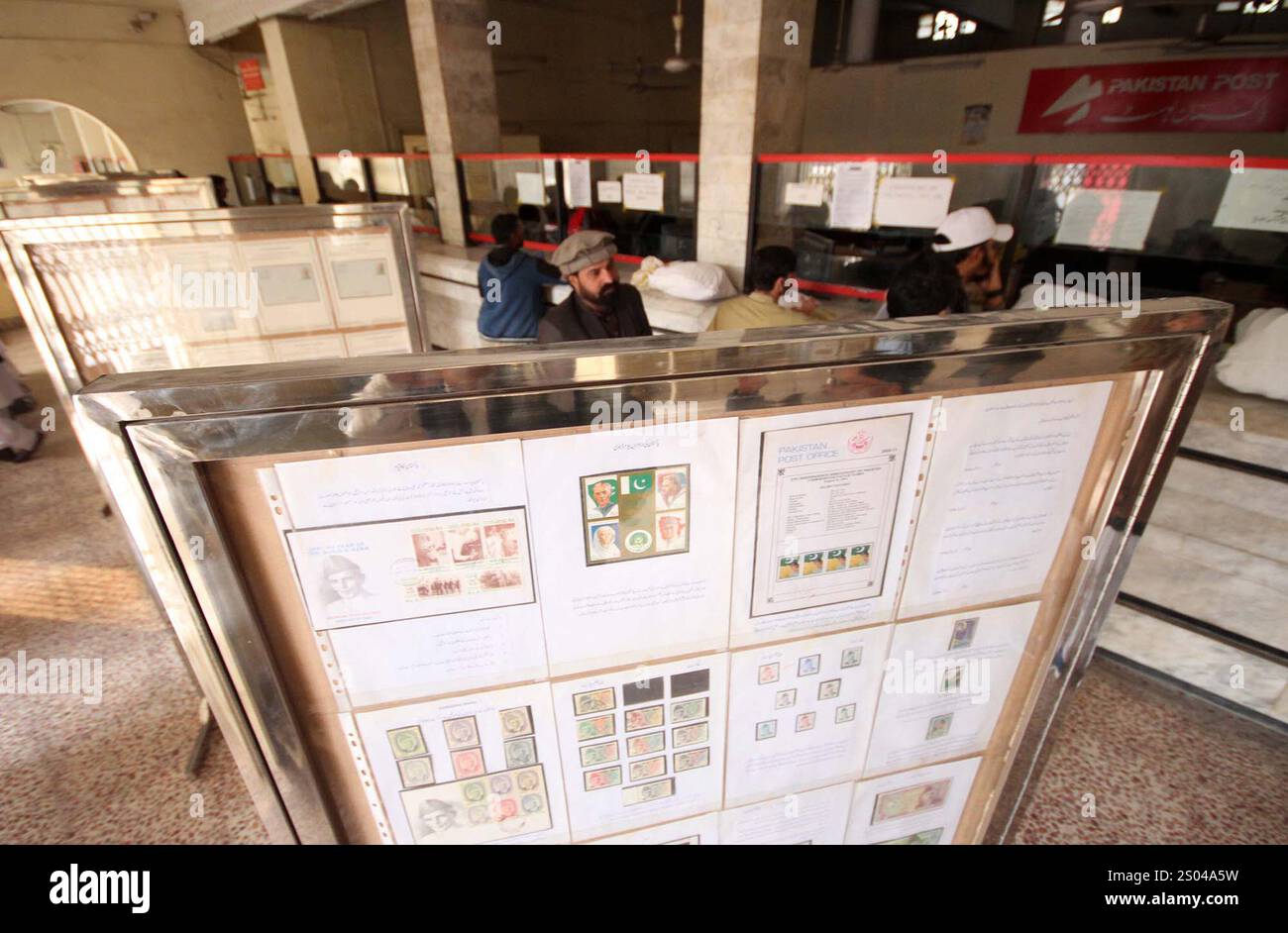 Visitors take keen interest in stamps during the Stamp Exhibition ...