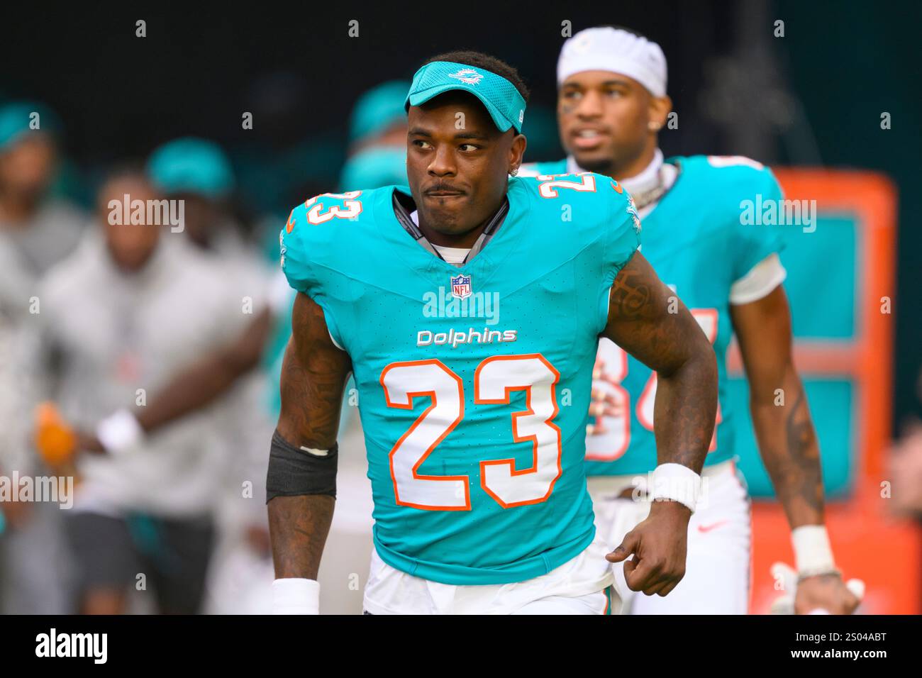 Miami Dolphins running back Jeff Wilson Jr. (23) runs onto the field during player introductions ...