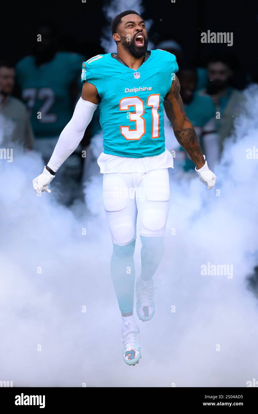 Miami Dolphins running back Raheem Mostert (31) yells as he runs onto ...
