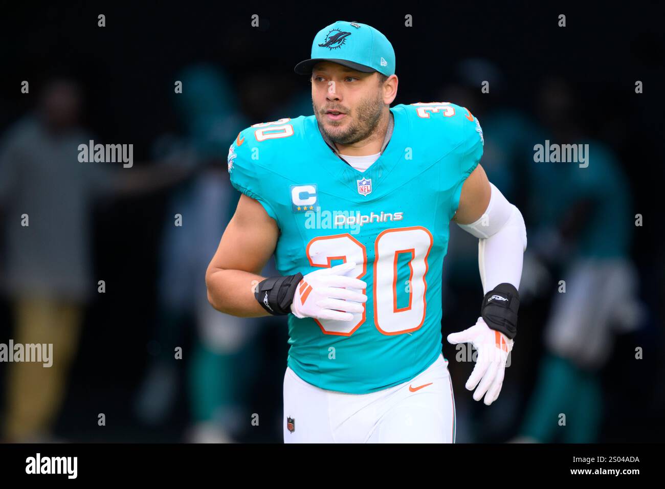 Miami Dolphins fullback Alec Ingold (30) runs onto the field during ...