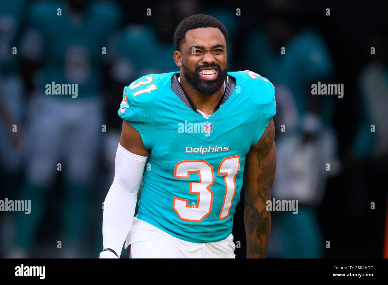 Miami Dolphins running back Raheem Mostert (31) yells as he runs onto ...
