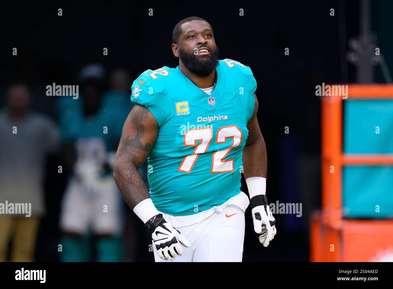 Miami Dolphins tackle Terron Armstead (72) runs onto the field during player introductions ...