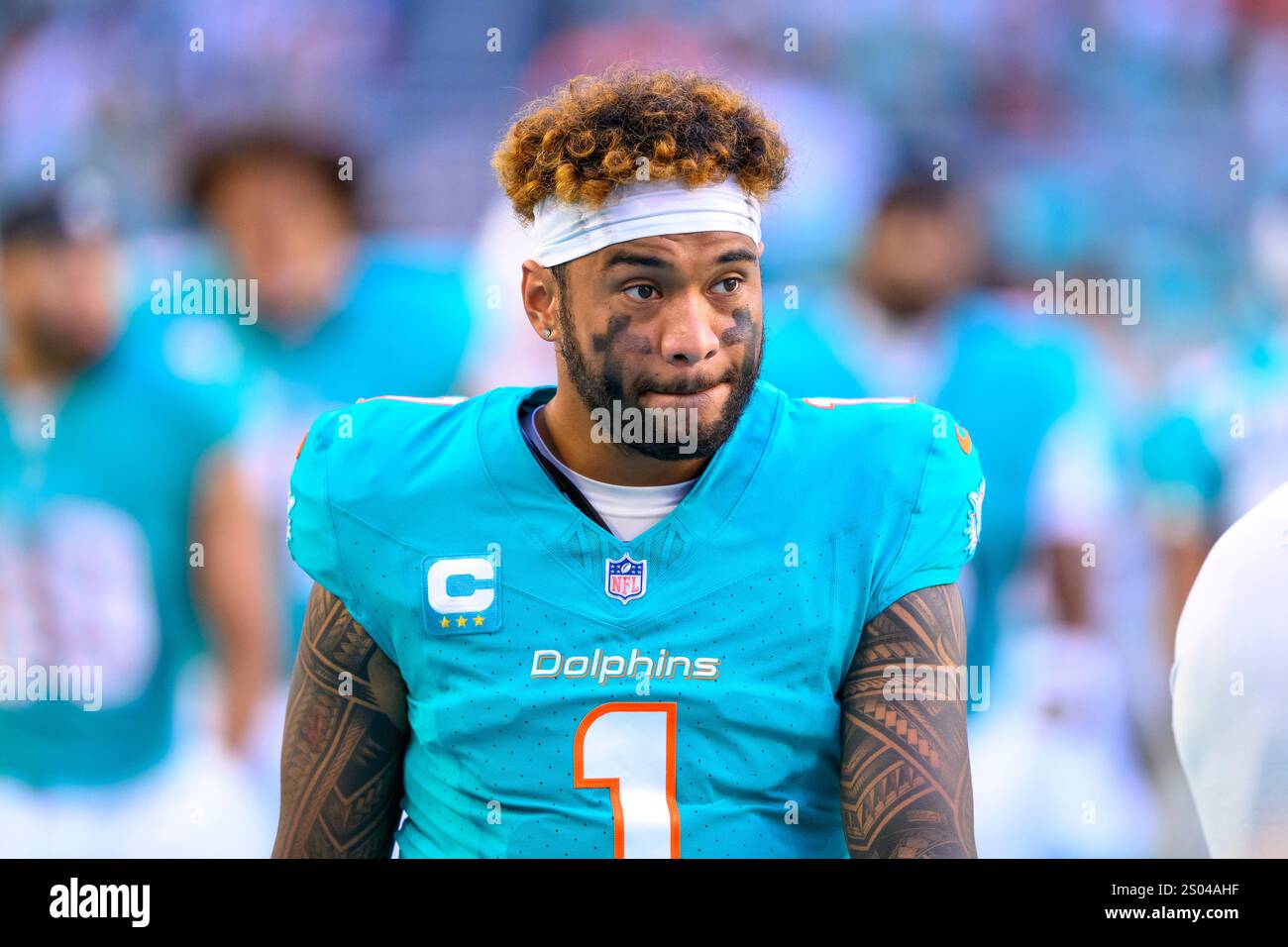 Miami Dolphins quarterback Tua Tagovailoa (1) stands on the sidelines ...