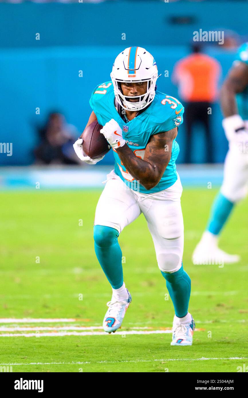 Miami Dolphins running back Raheem Mostert (31) runs with the ball during an NFL football game ...