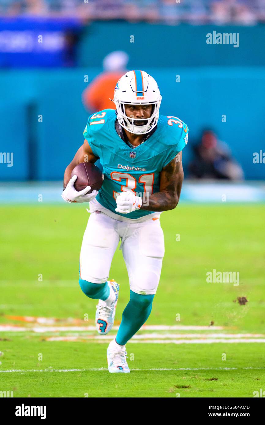 Miami Dolphins running back Raheem Mostert (31) runs with the ball during an NFL football game ...