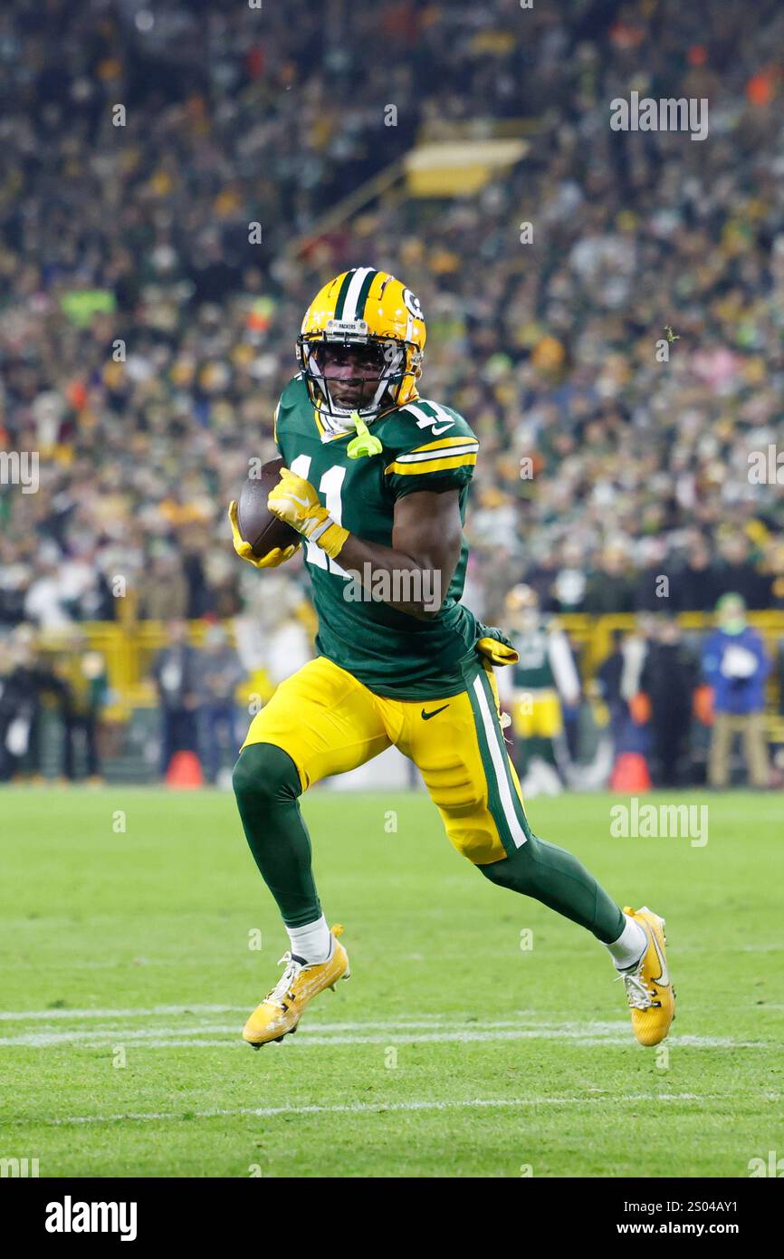 Green Bay Packers wide receiver Jayden Reed (11) runs after the catch ...