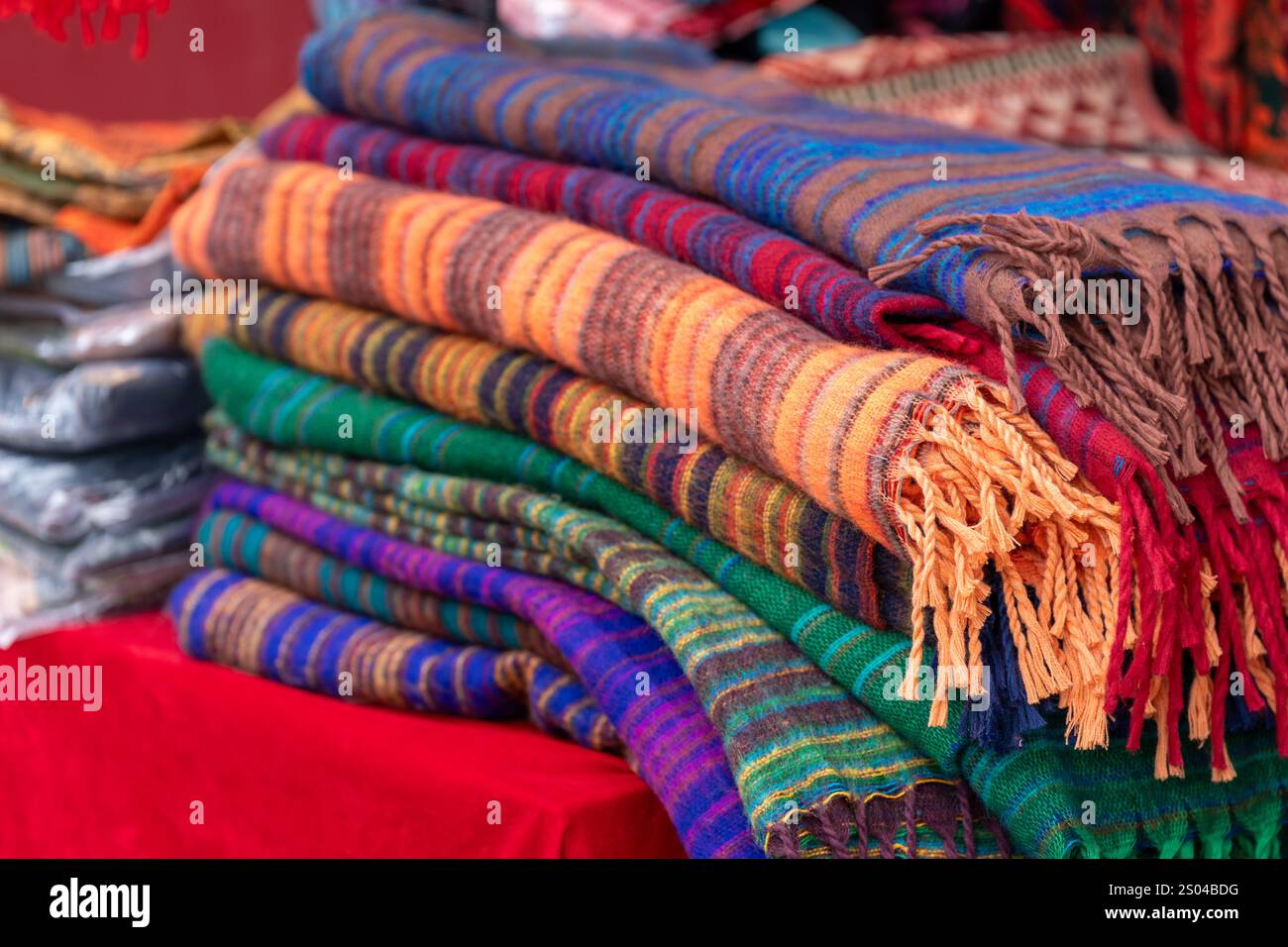 Textiles - blankets and scarves - for sale at a market Stock Photo - Alamy